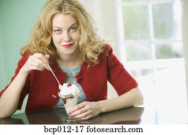 Woman eating an ice cream cone. Stock Photograph | bcp012-56 | Fotosearch