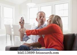 A brother and sister fighting over the remote control Picture ...