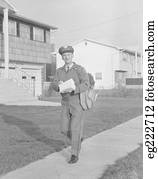 1950S Postal Mailman Walking Suburban Street Wearing Uniform Delivering ...