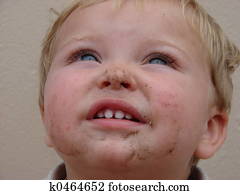 Baby boy pulls funny face with scrunched up nose Stock Image ...