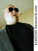 Mafia with arms crossed and a gunon hand Picture | k0572674 | Fotosearch