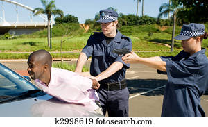 Policemen Arresting Suspect Stock Photos and Images. 136 policemen ...