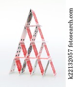 Stock Photo of Hand Building House Tower Of Playing Cards Balance ...