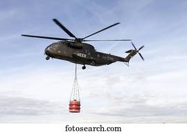 CH-53 helicopter carrying a 5000-liter water tank during an exercise ...