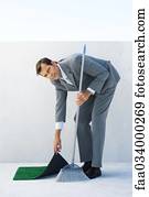 Woman sweeping under rug of artificial turf Stock Image | paa485000003 ...