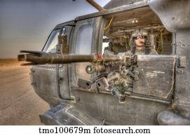 A U. S. Army UH-60 Black Hawk helicopter prepares to pick up soldiers ...