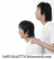 Students putting arms around each other's shoulder in school Stock ...