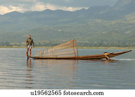 Fisherman in row boat Stock Photo | u16414698 | Fotosearch