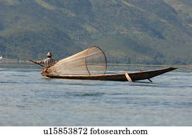 Fisherman in row boat Stock Photo | u16414698 | Fotosearch