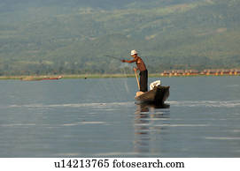 Fisherman in row boat Stock Photo | u16414698 | Fotosearch