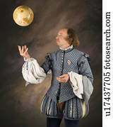 William Shakespeare in period clothing holding feather pen standing ...