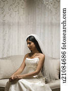 Young woman in white dress sitting on chair (portrait) Stock Image ...