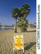 Warning sign on beach. Stock Photo | is098sn7x | Fotosearch